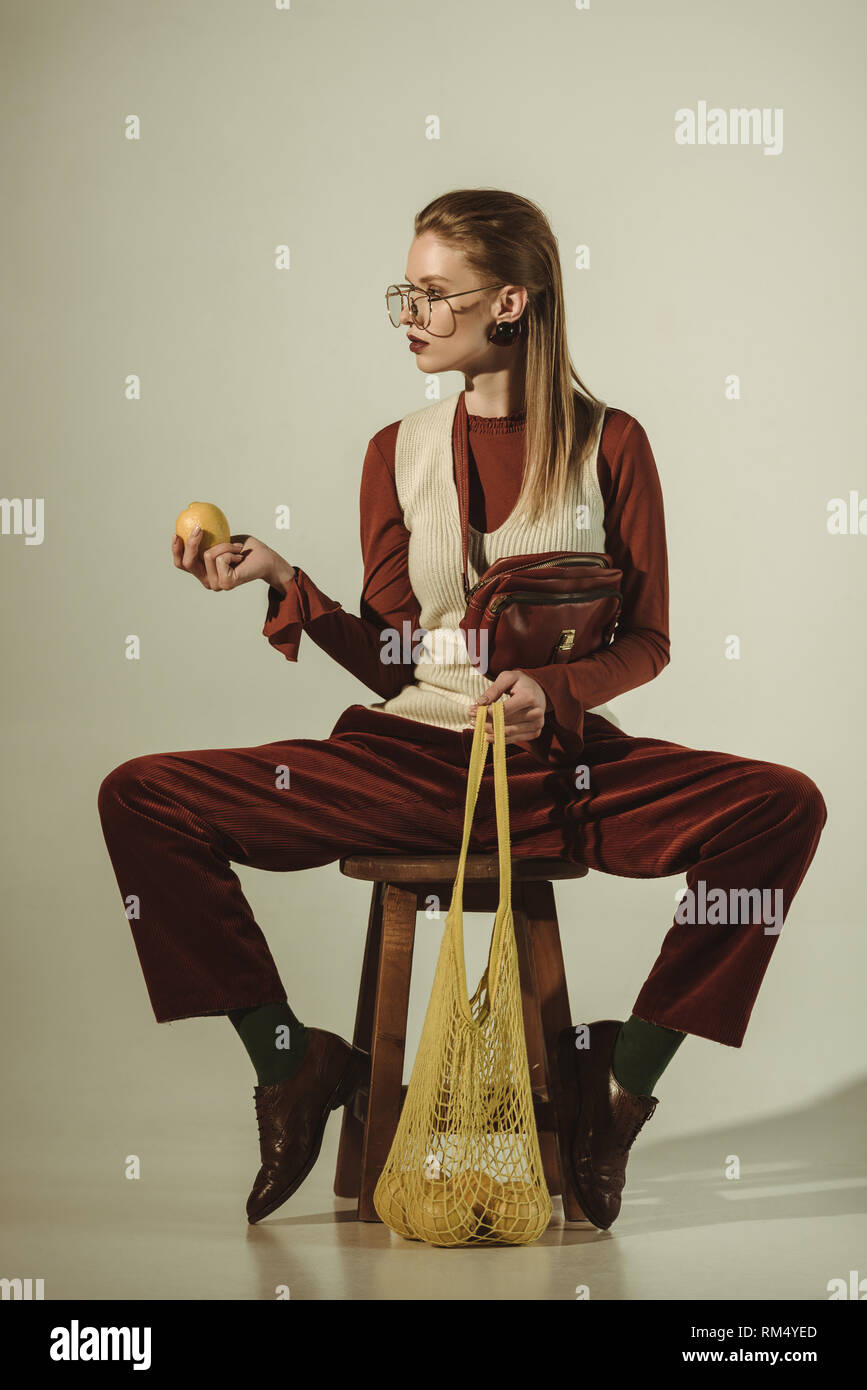 Girl sitting on stool hi-res stock photography and images - Alamy