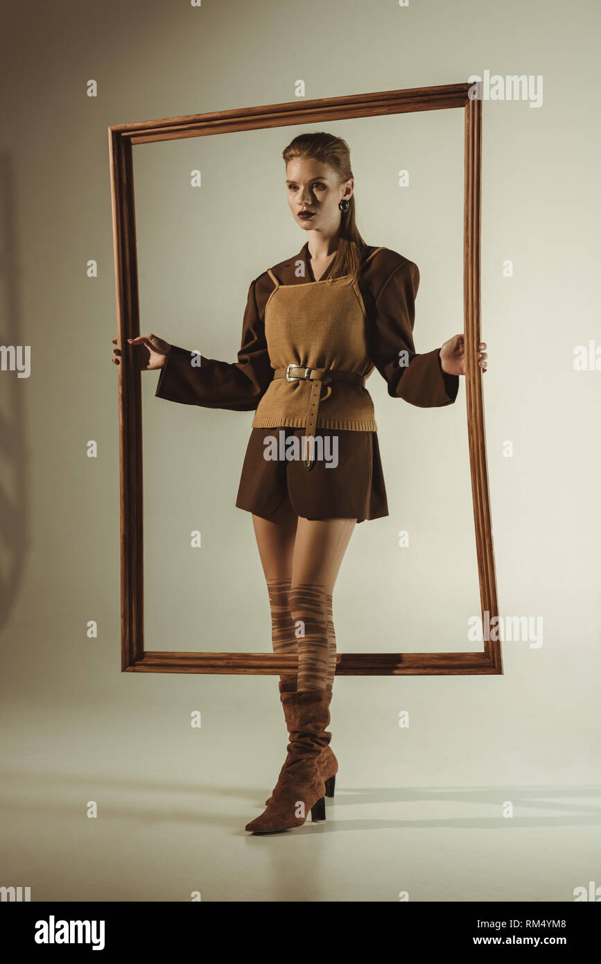 attractive woman in vintage style posing with big wooden frame Stock ...