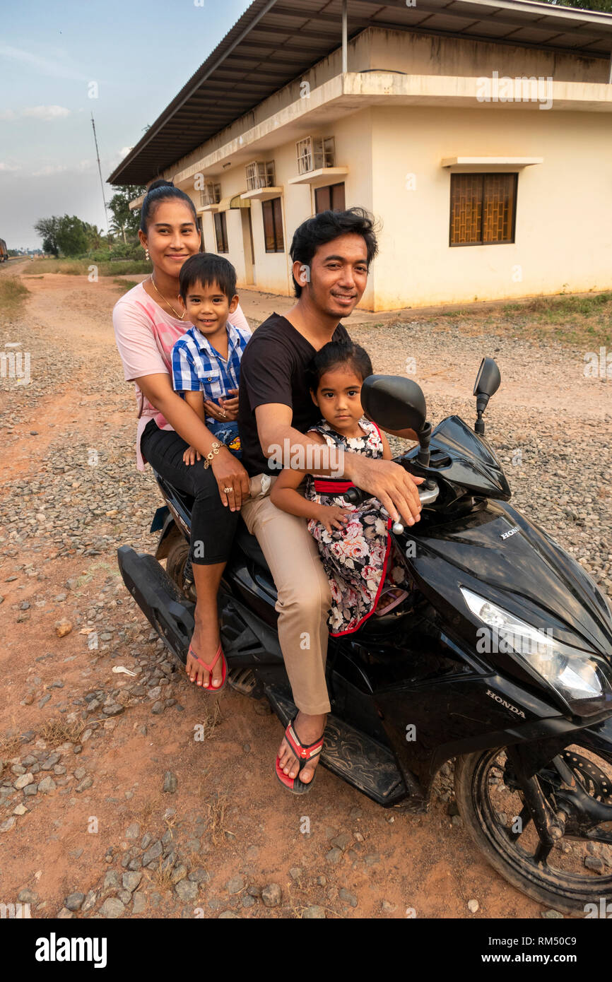 Cambodia, Kampot Province, Kampot, family of 4 people sharng motorbike ...