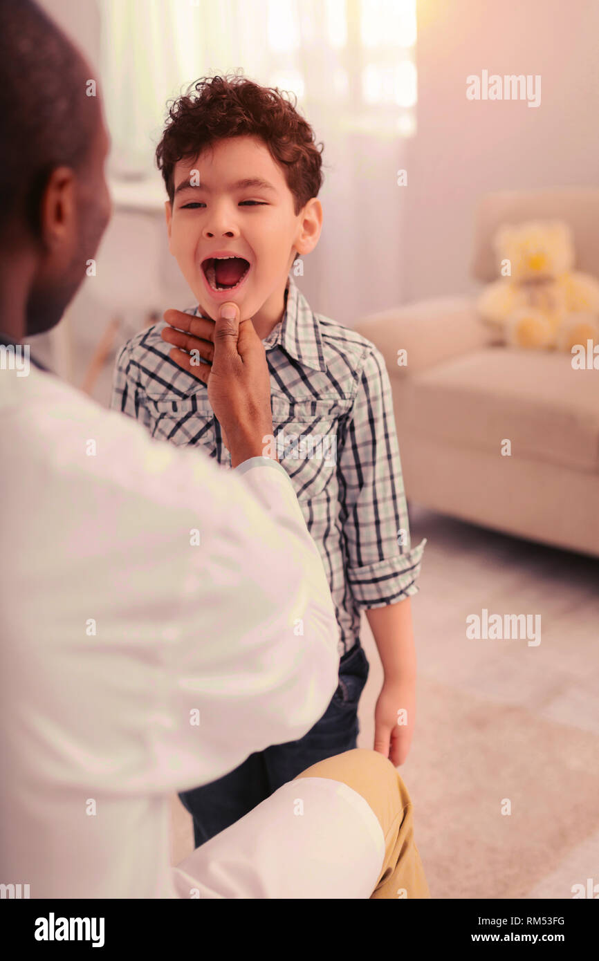 Child showing his teeth to his doctor Stock Photo - Alamy