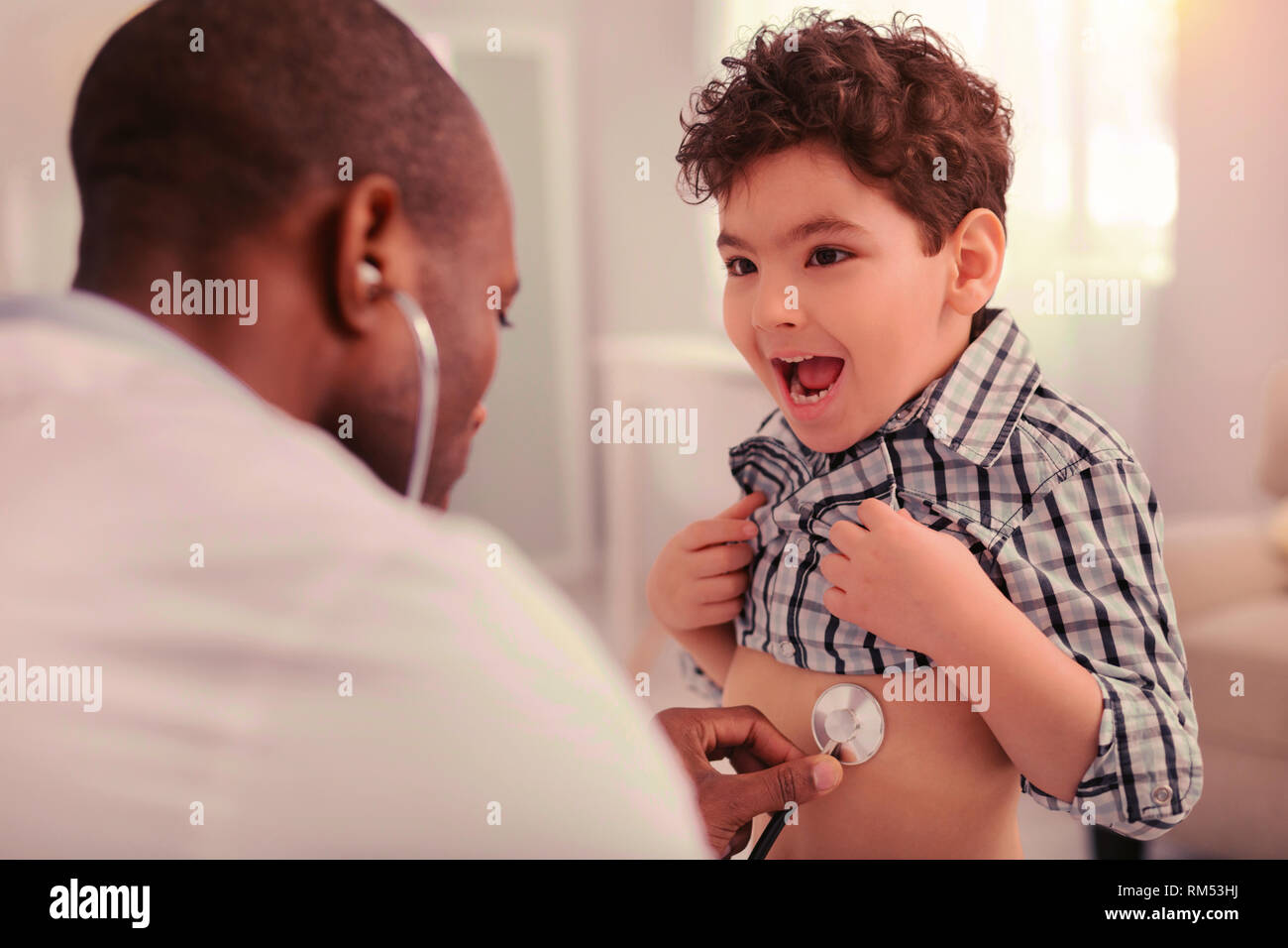 Children is being examined by the doctor using phonendoscope Stock ...