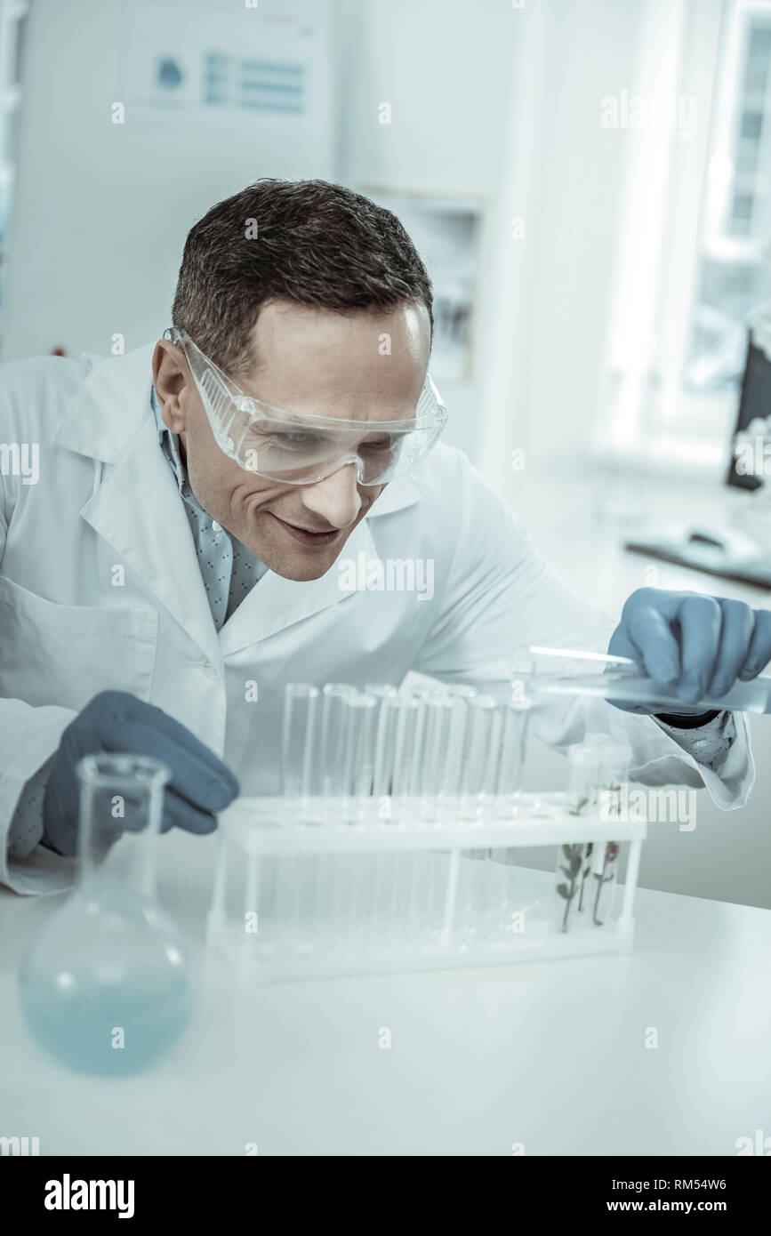 Smiling worker of laboratory having usual workday Stock Photo - Alamy