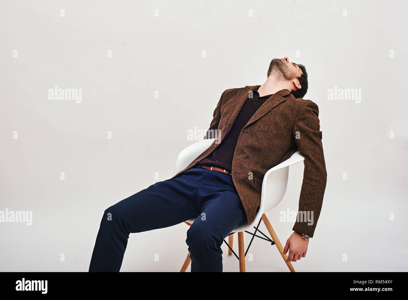 Jacket on back of chair hi-res stock photography and images - Alamy