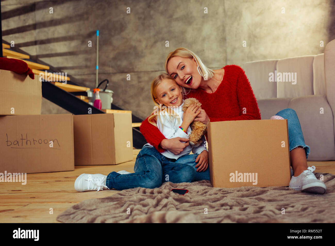 Positive delighted female person caressing her daughter Stock Photo - Alamy