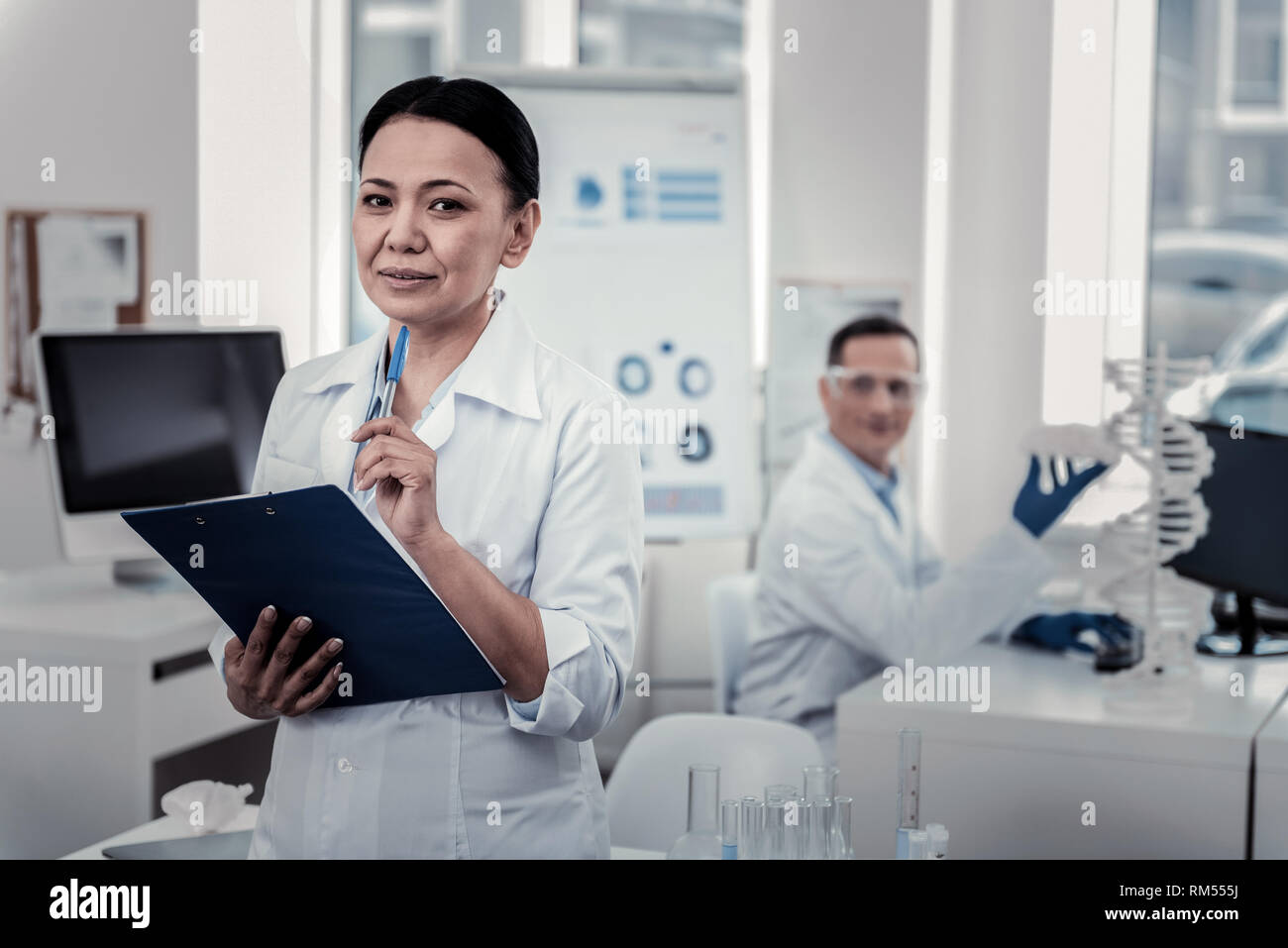 Young woman working as a researcher in the laboratory Stock Photo - Alamy