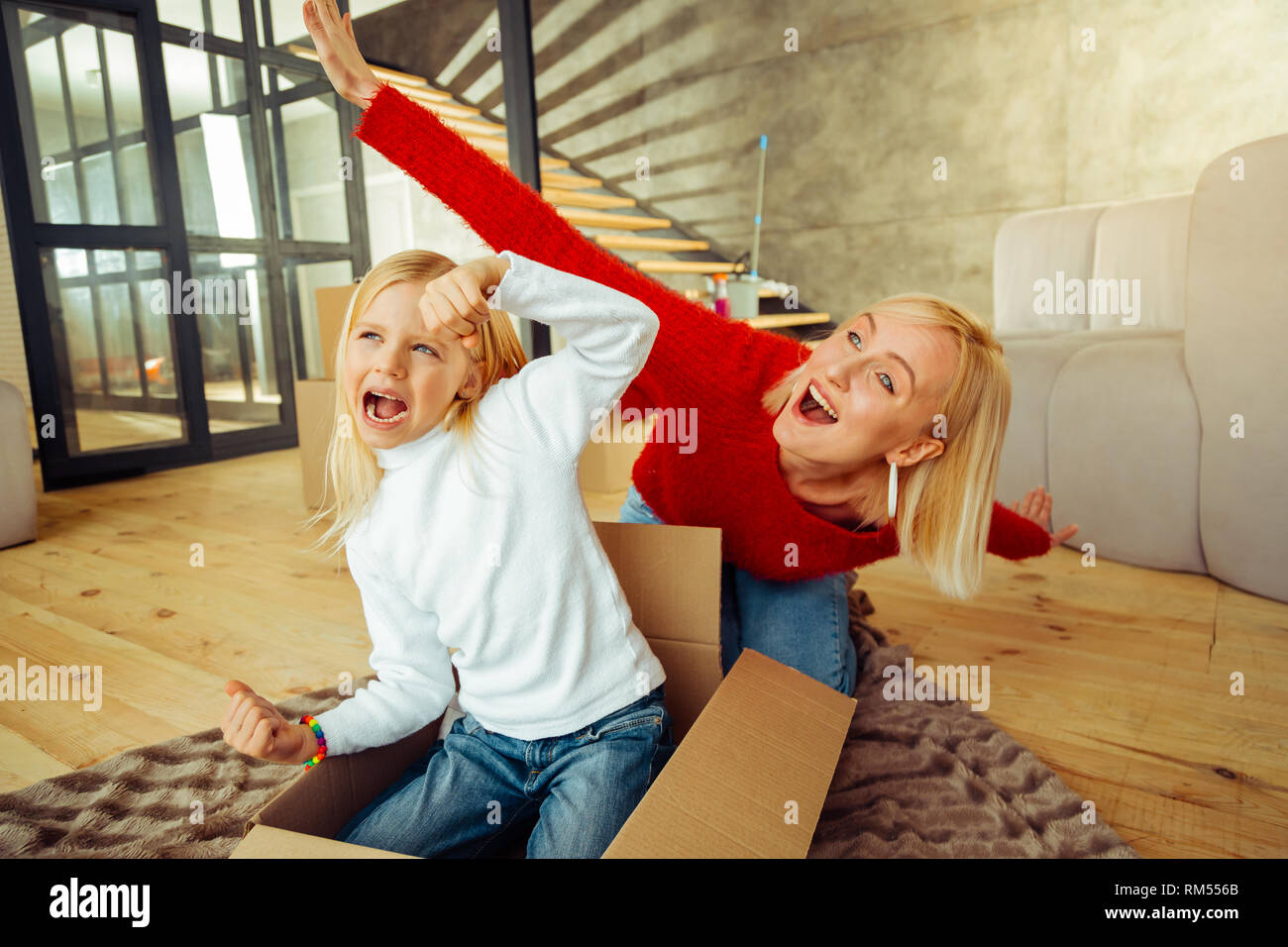 Cheerful blonde female keeping smile on her face Stock Photo - Alamy