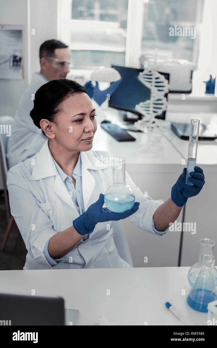 Scientist performing experiment chemical hi-res stock photography and ...
