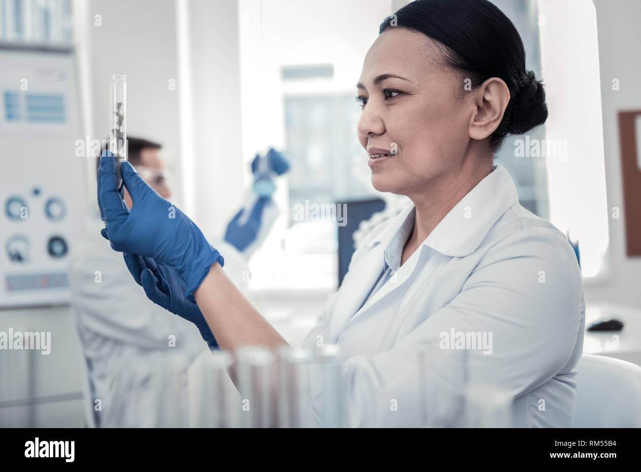 Female biologist studying the plant in the lab Stock Photo - Alamy