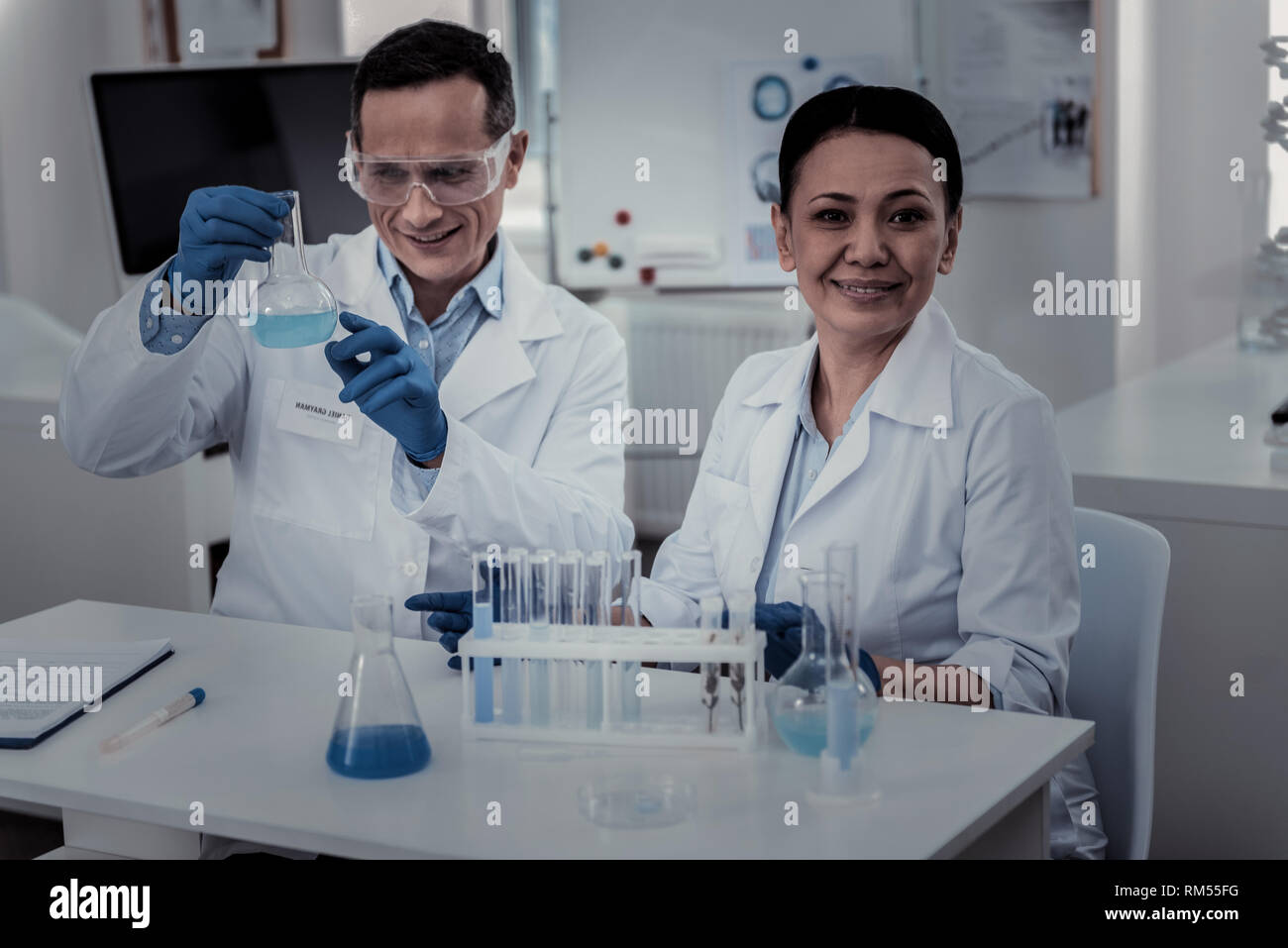 Young scientists conducting research in the laboratory Stock Photo - Alamy