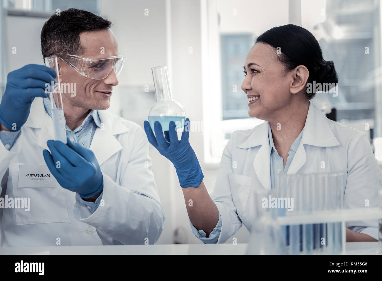 Enthusiastic and motivated scientists conducting chemical research ...