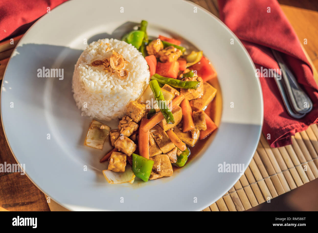 Traditional Balinese cuisine. Vegetable and tofu stir-fry with rice ...