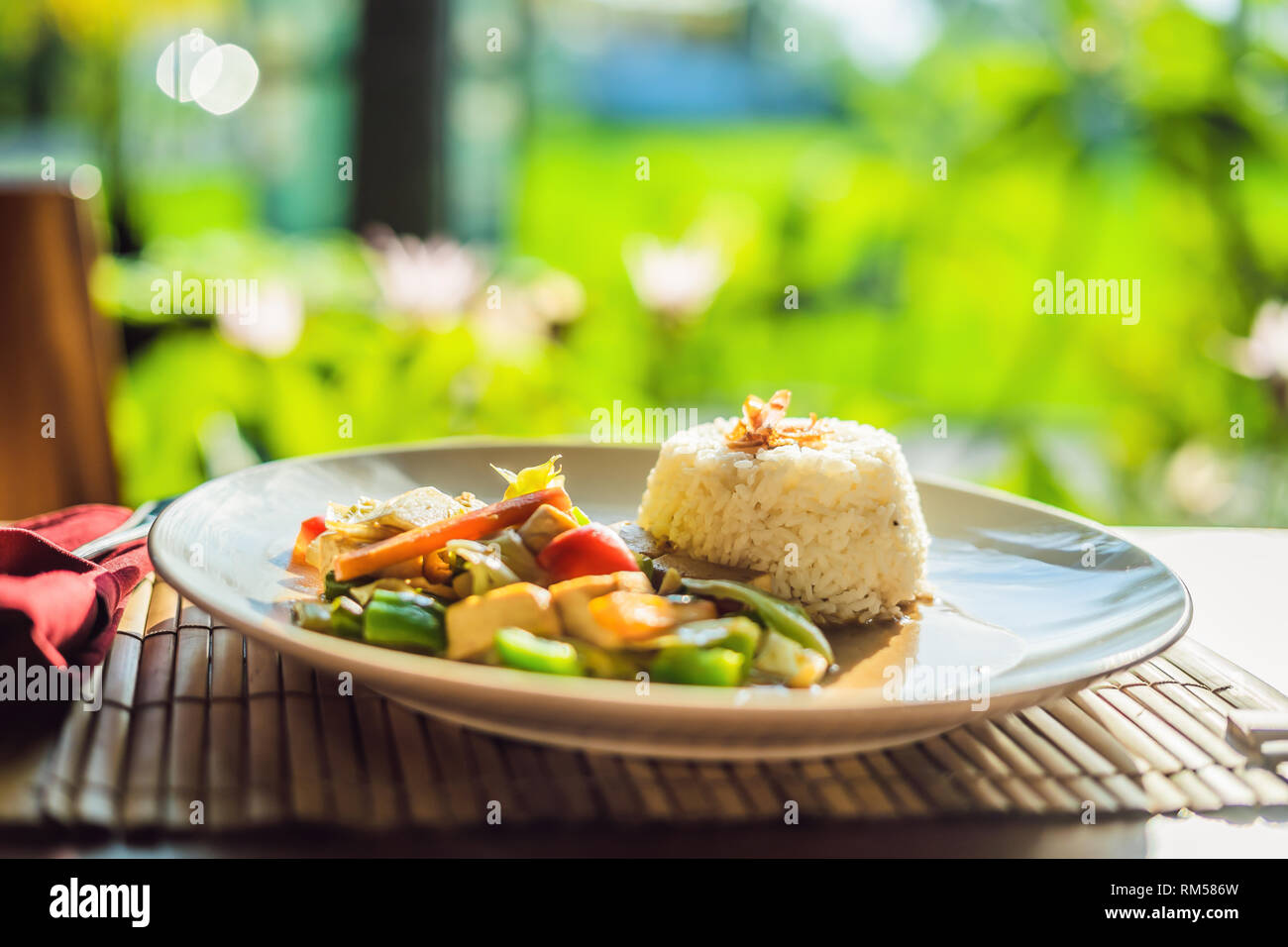 Traditional Balinese cuisine. Vegetable and tofu stir-fry with rice ...