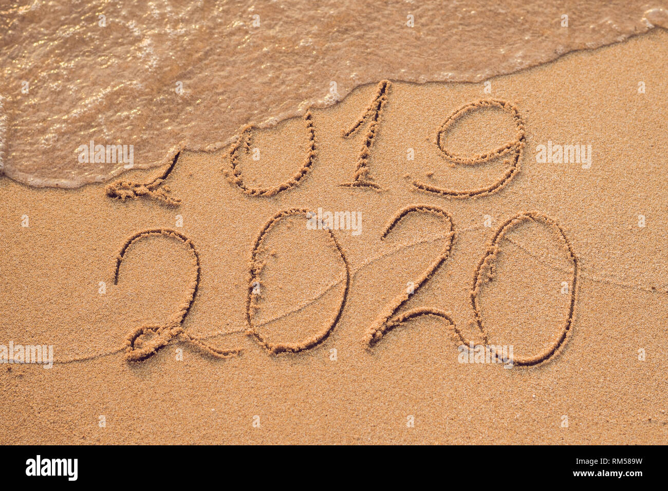 New Year 2020 is coming concept - inscription 2019 and 2020 a beach ...