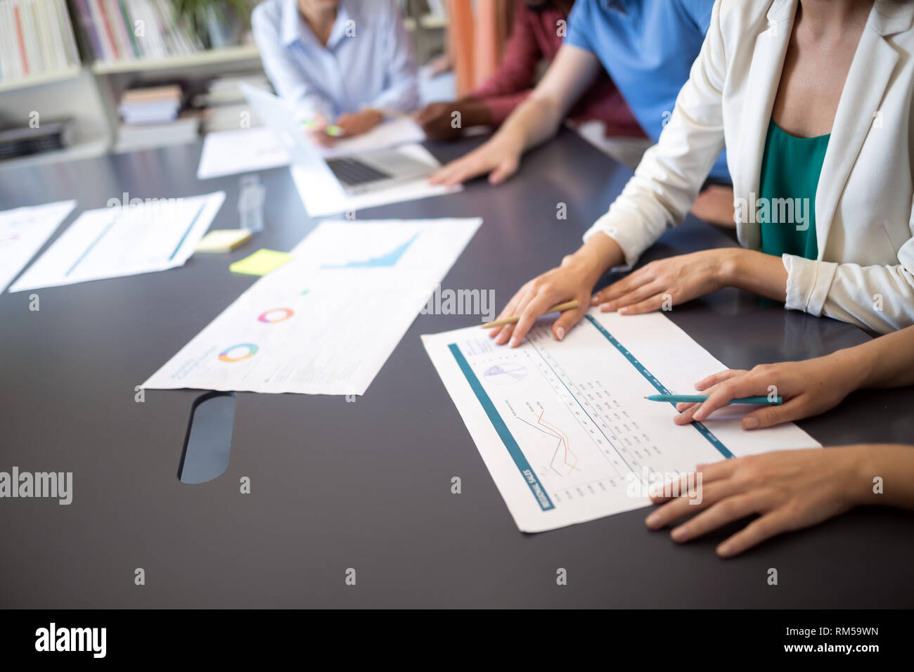 Group of business people collaborating on project in office Stock Photo ...