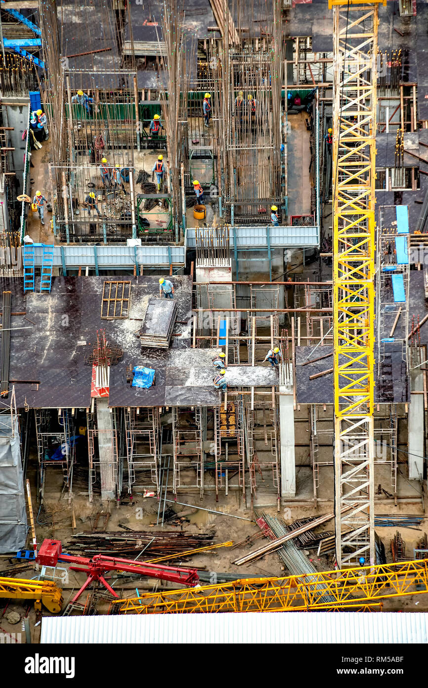 Aerial view of a building construction site in progress with tower ...