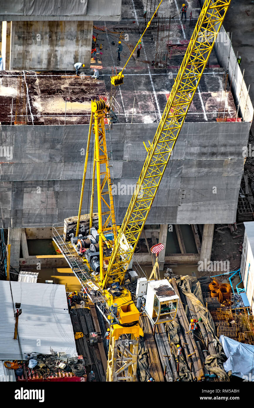 Aerial view of a building construction site in progress with tower ...