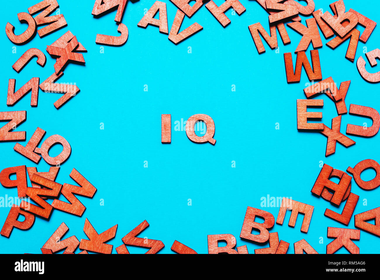 Word ,abbreviation IQ of wooden letters on a blue background Stock ...