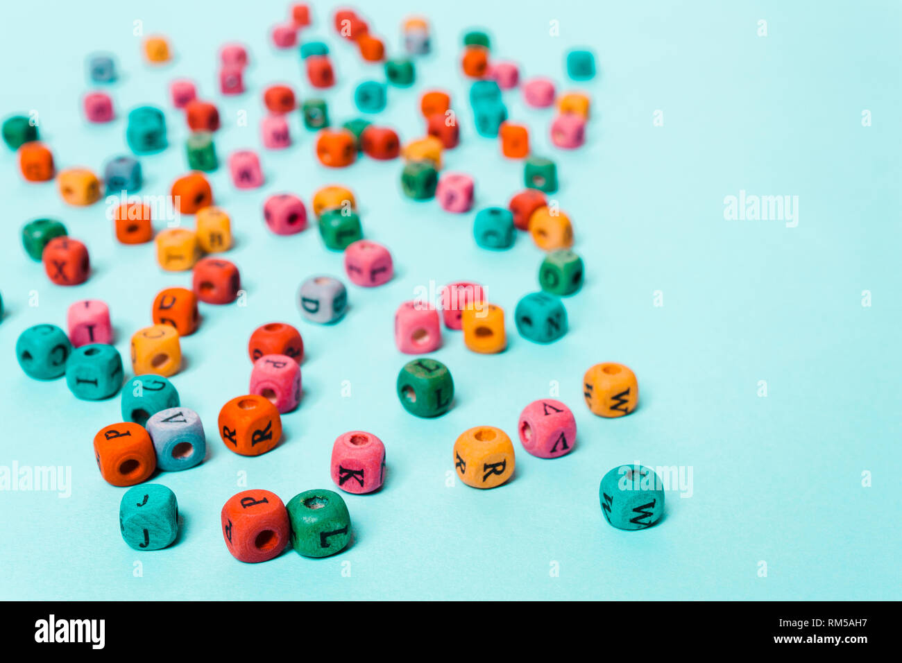 Colored cubes with letters on a blue background. Concept of creativity ...