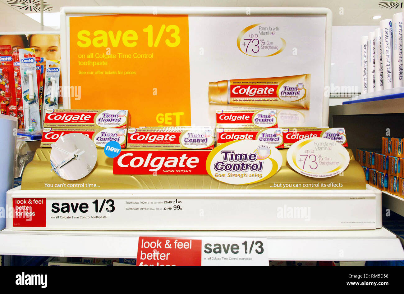 A display of Colgate toothpaste with a third off, save 1/3 Stock Photo ...