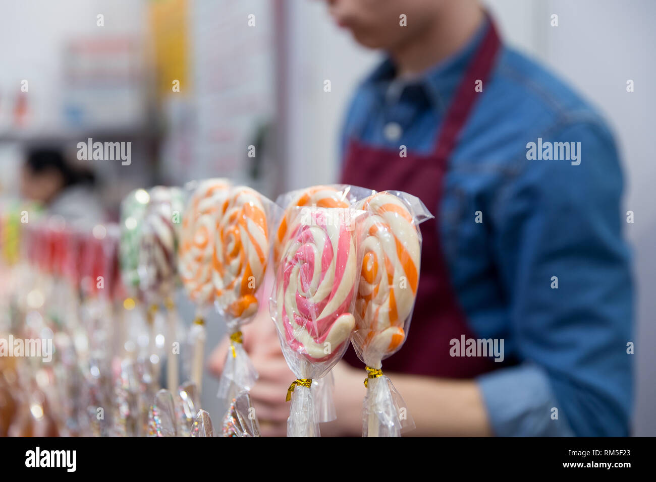 Group of packed colorful round lollipops on fair Stock Photo - Alamy