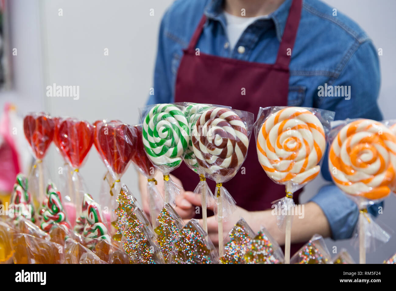 Sweet glazed andy lollipops for sale on farmer market or country fair ...