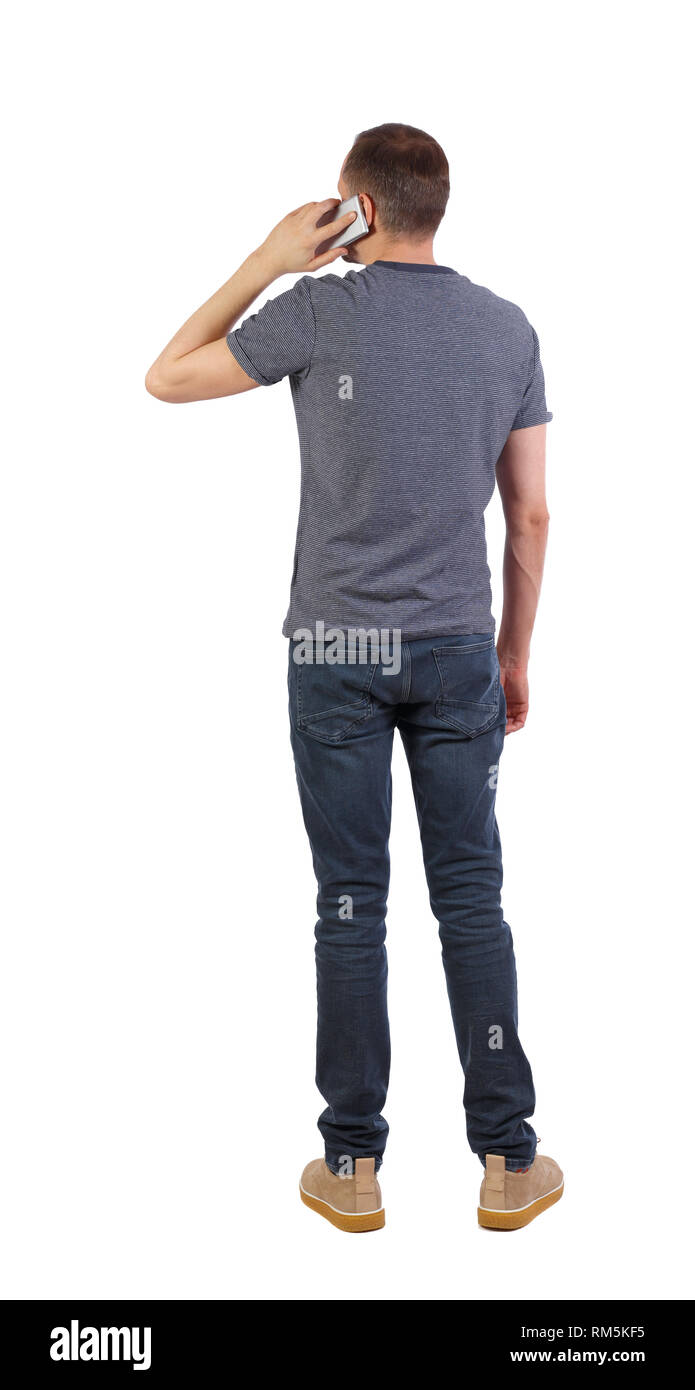 back view of a man talking on the phone. backside view of person. Rear ...