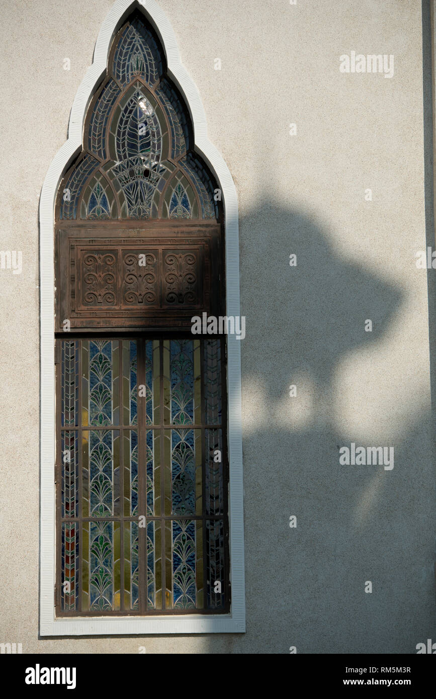 Stained glass window, with shadow of minaret, Sultan Omar Ali ...