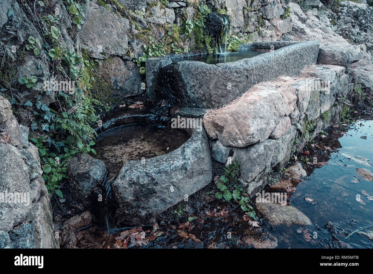 Two ancient stone water troughs in the hills of the Balagne region of ...