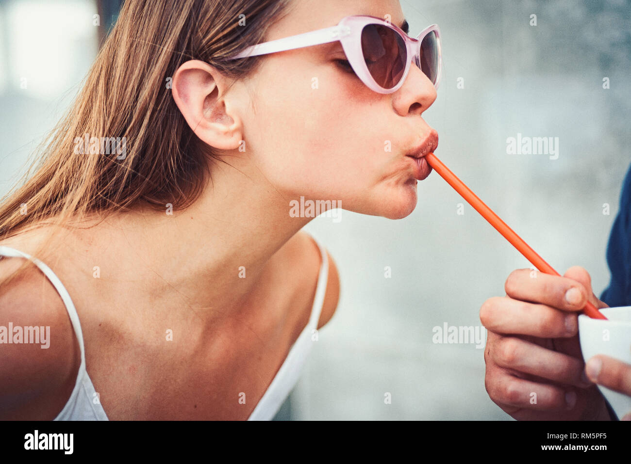 Drinking soft drink through a straw hi-res stock photography and images - Alamy