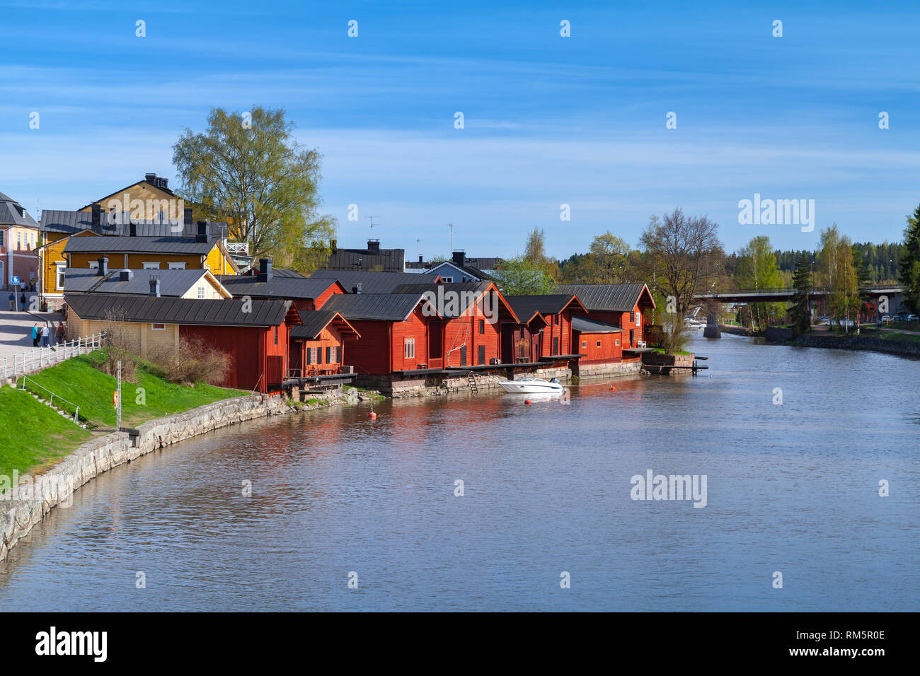 Old wooden houses are on the river coast, historical part of Porvoo ...