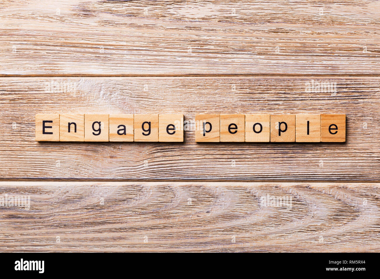 ENGAGE PEOPLE word written on wood block. ENGAGE PEOPLE text on wooden ...