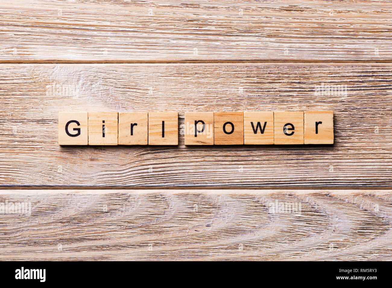 Girl Power word written on wood block. Girl Power text on wooden table ...