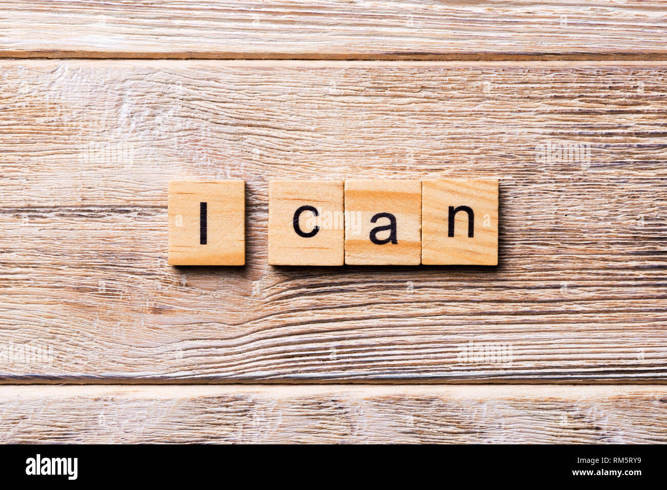 i can word written on wood block. i can text on wooden table for your ...