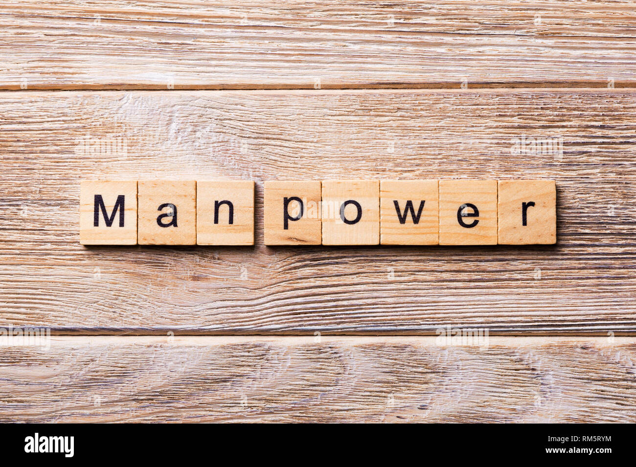Man Power word written on wood block. Man Power text on wooden table ...
