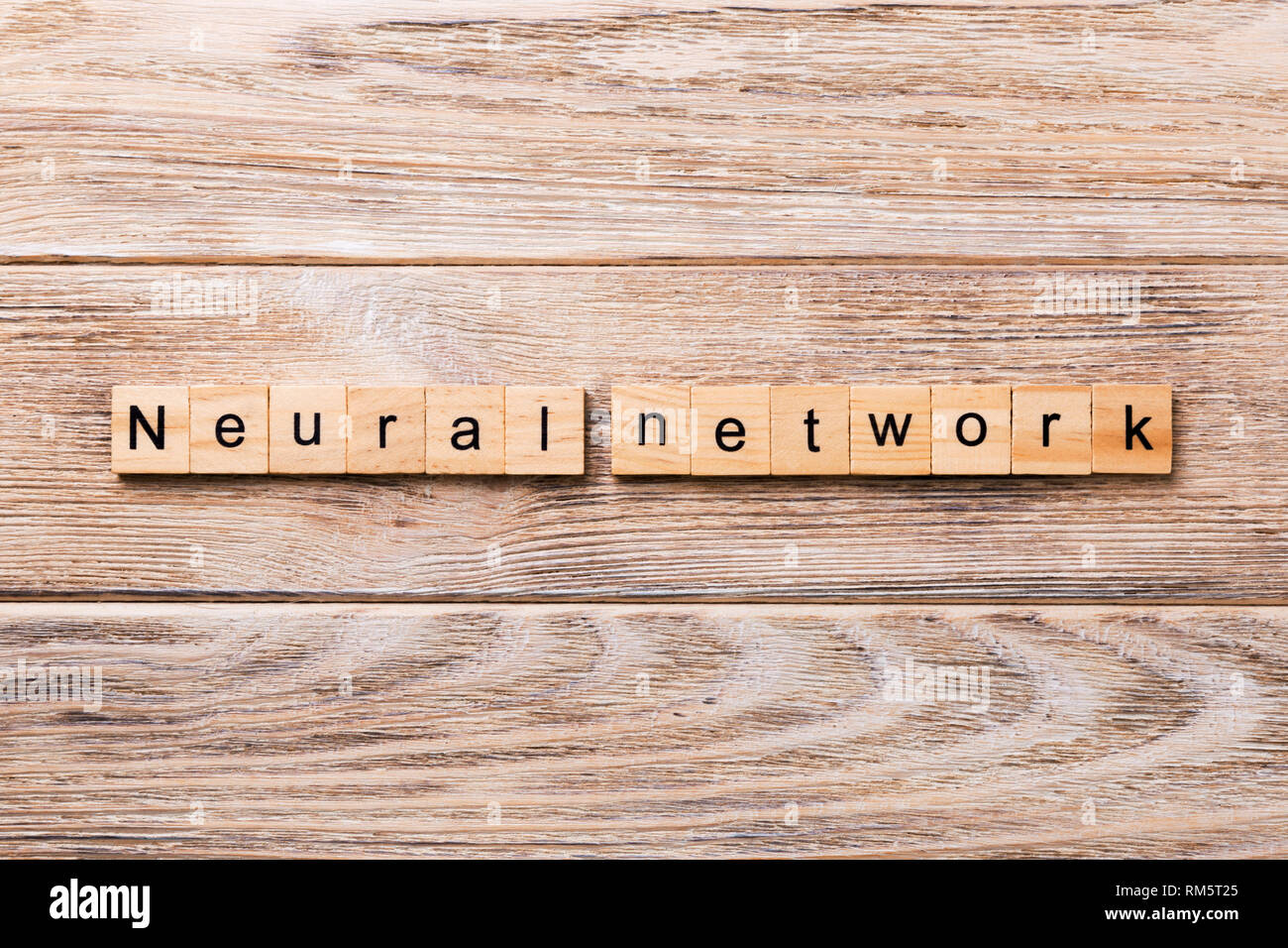 NEURAL NETWORK word written on wood block. NEURAL NETWORK text on ...