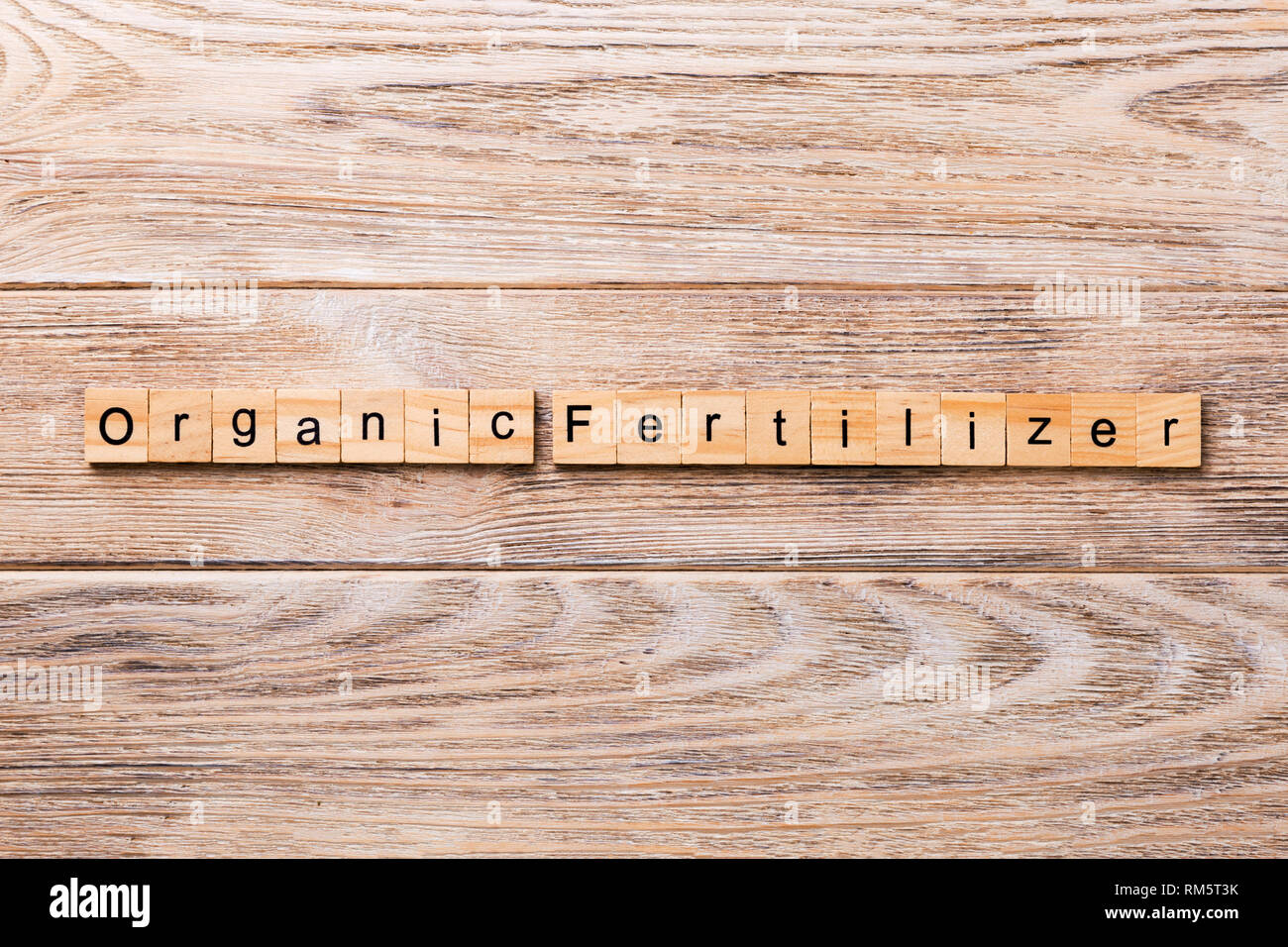 organic fertilizer word written on wood block. organic fertilizer text ...