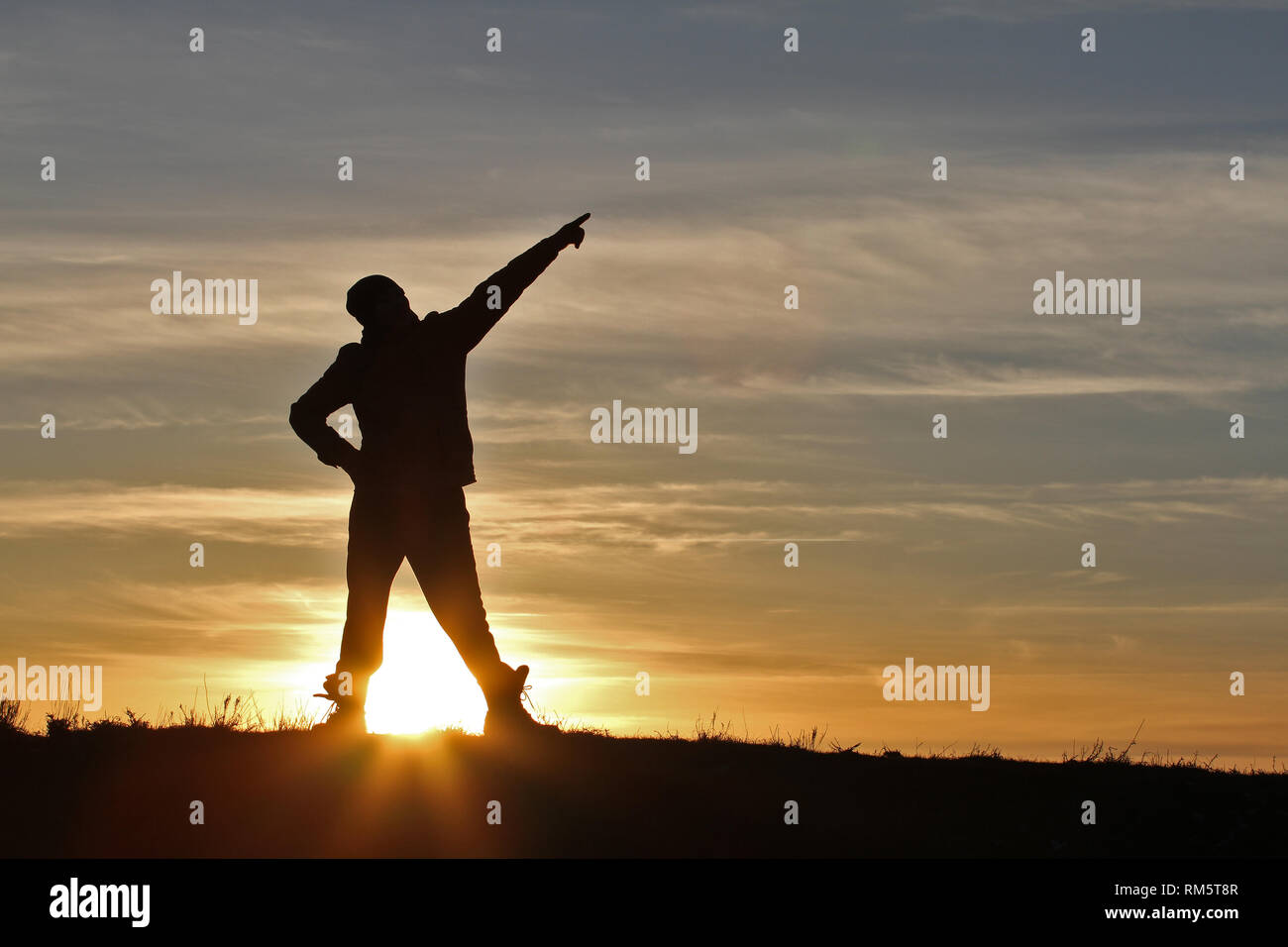 Silhouette men on the background of an incredible sunset Stock Photo ...