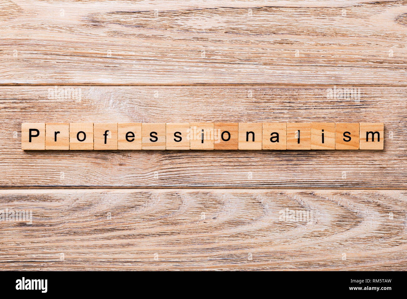Professionalism word written on wood block. Professionalism text on ...