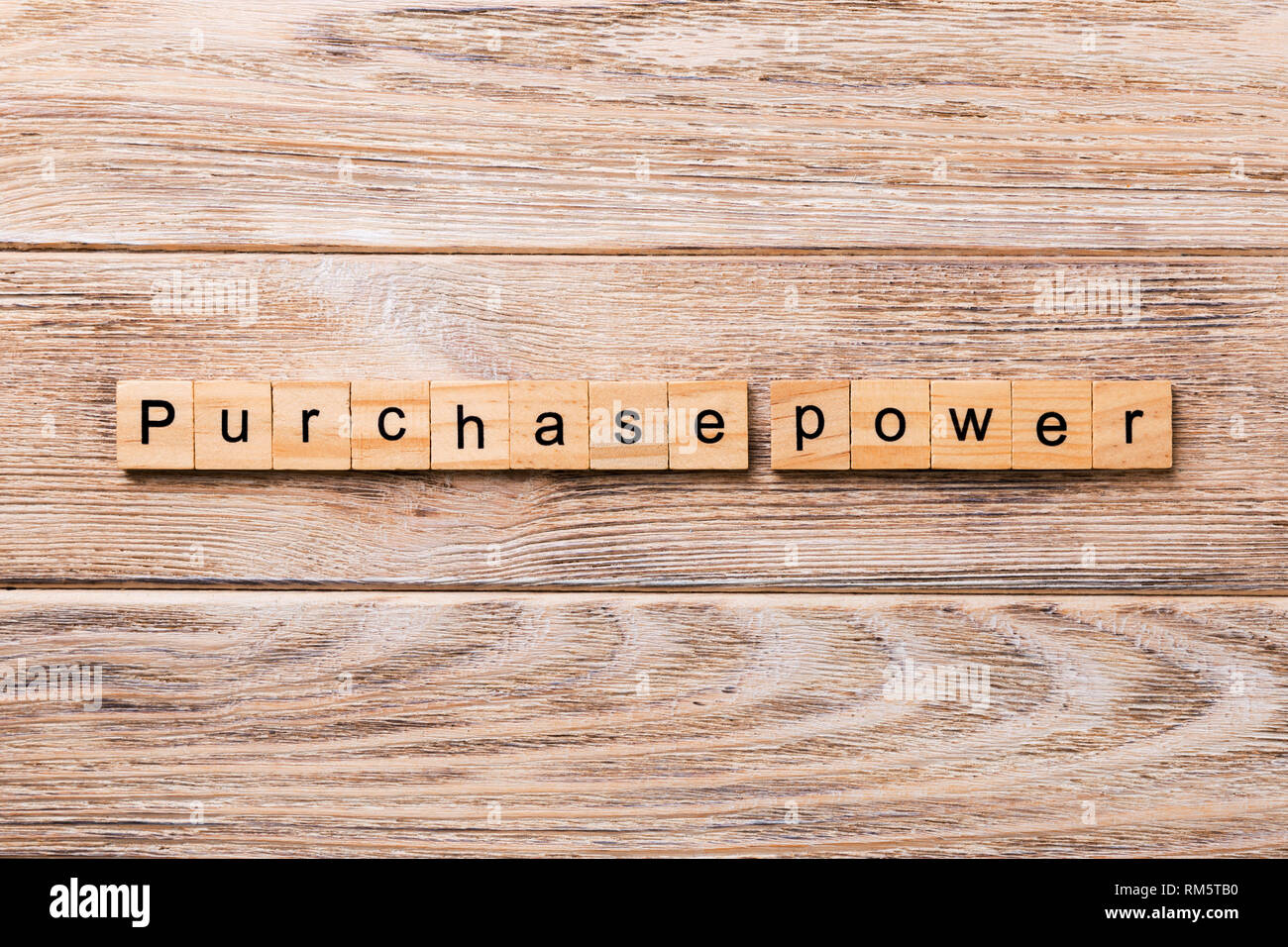 Purchase power word written on wood block. Purchase power text on ...