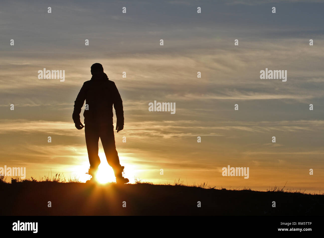 Silhouette men on the background of an incredible sunset Stock Photo ...