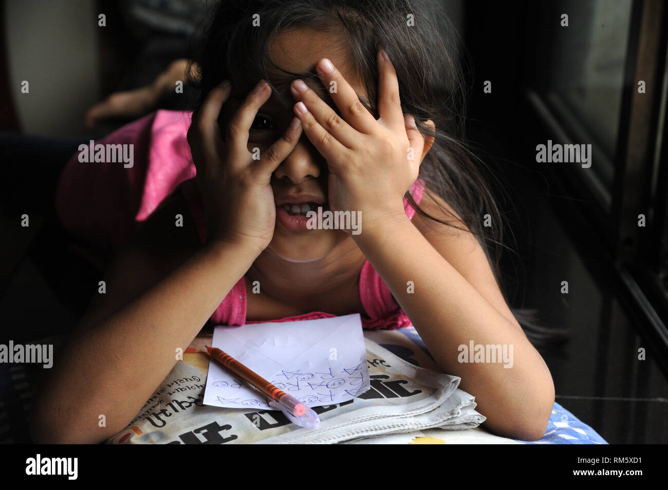 Little girl covering face with hands Stock Photo - Alamy