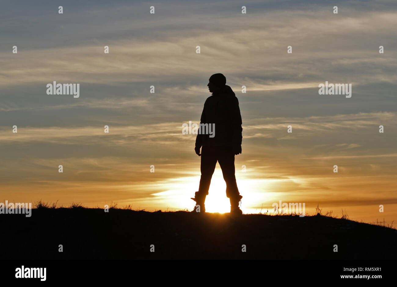 Silhouette men on the background of an incredible sunset Stock Photo ...