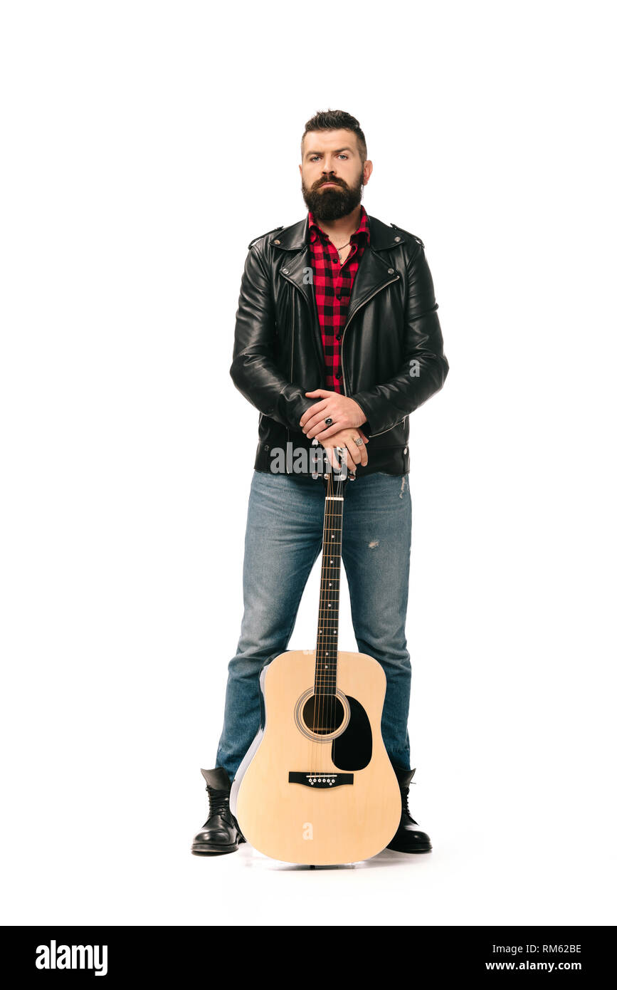 handsome rocker in black leather jacket posing with acoustic guitar ...