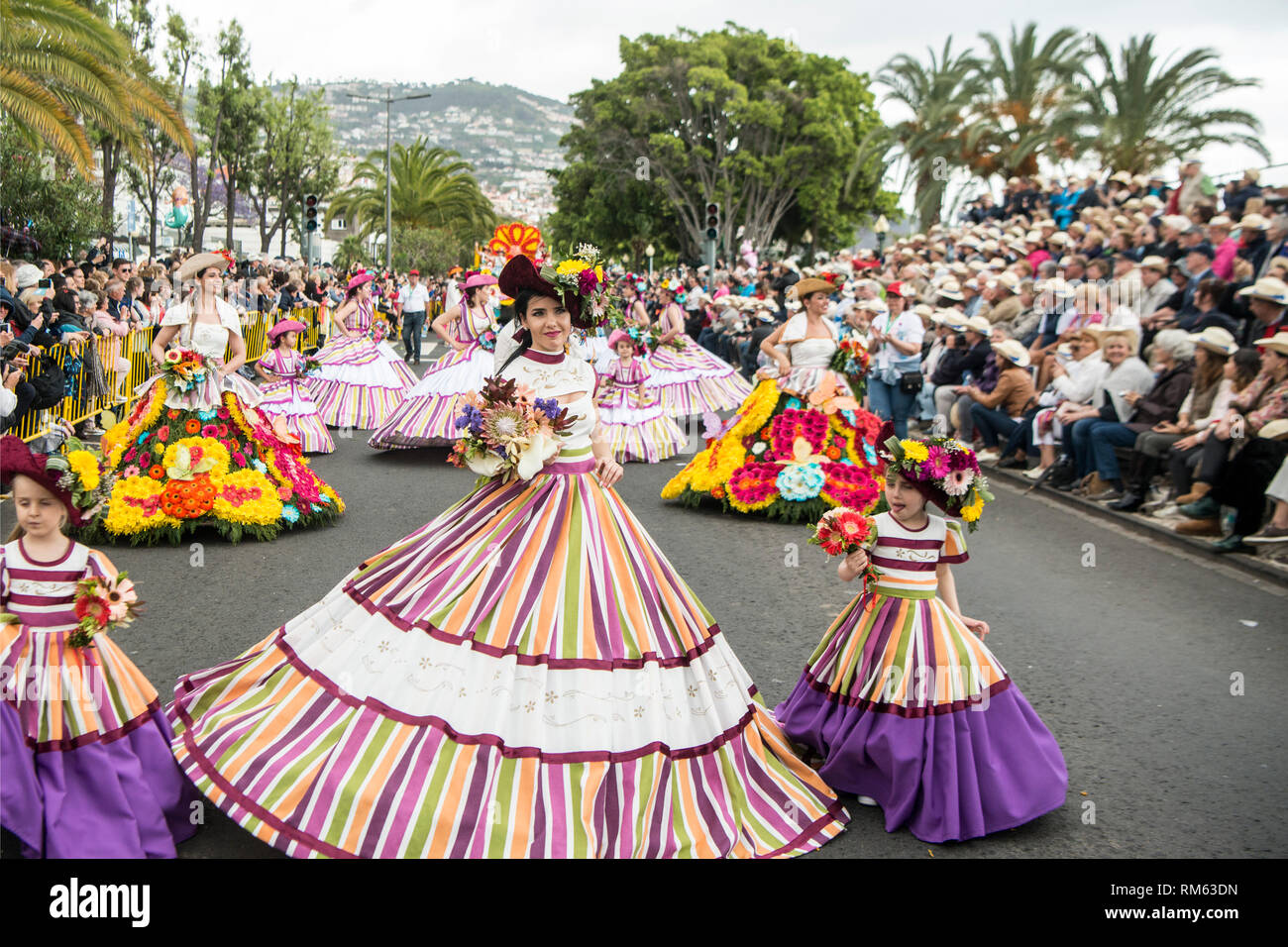 women dressed in colorful clothes at the Festa da Flor or Spring Flower ...