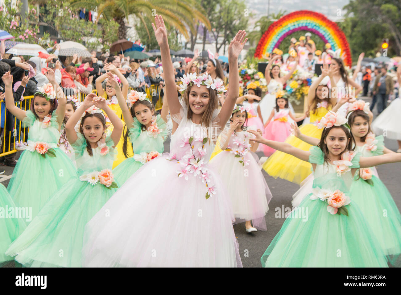 children dressed in colorful clothes at the Festa da Flor or Spring ...