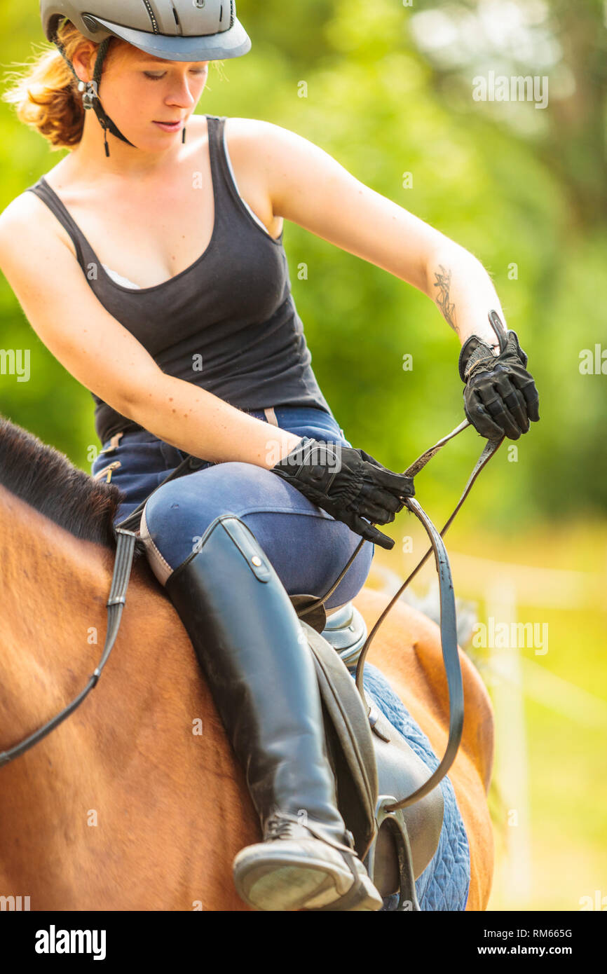 Active woman girl jockey training riding horse. Equestrian sport ...