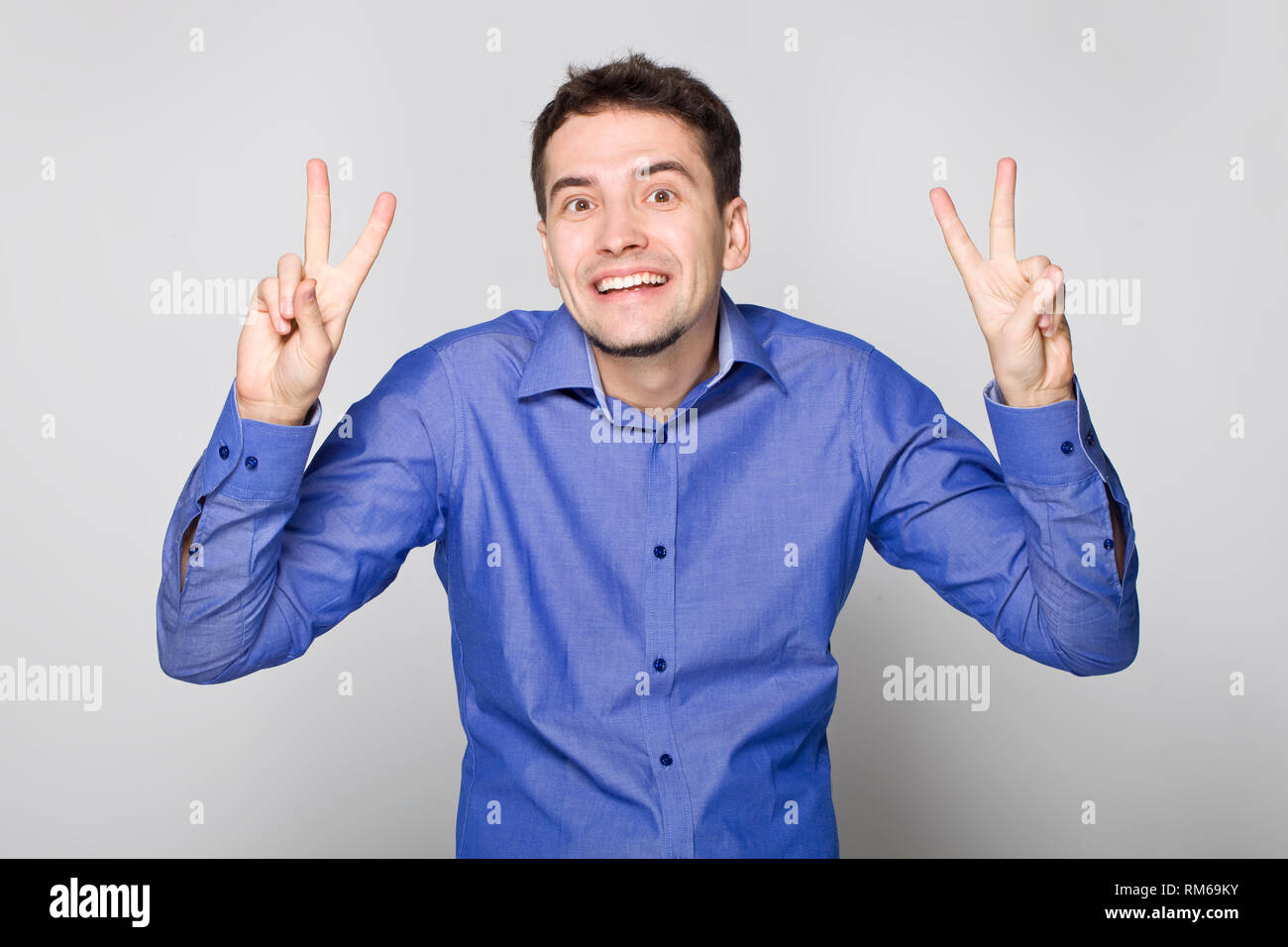 Funny guy showing peace Stock Photo - Alamy