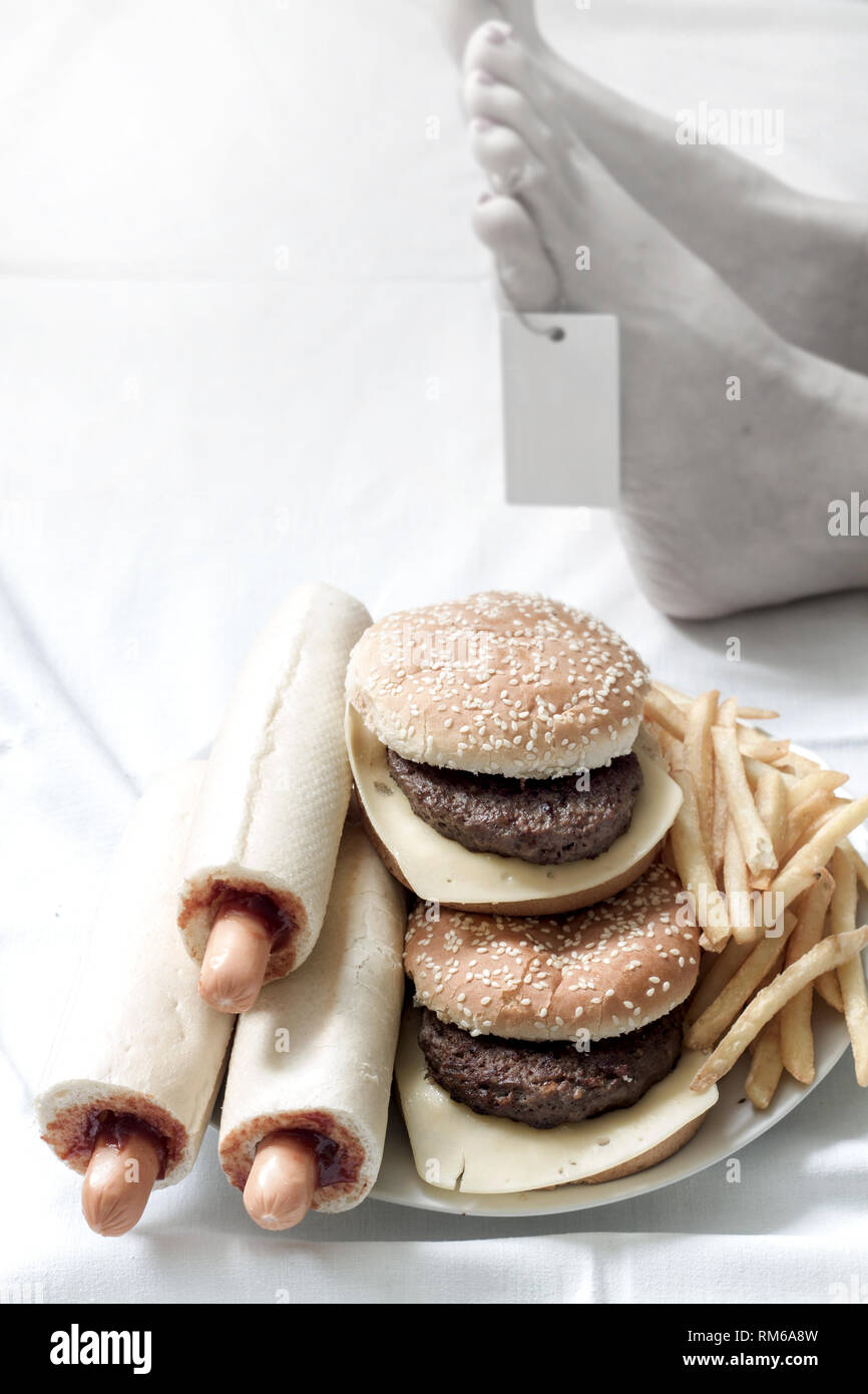 Unhealthy junk fast food and death body in morgue abstract of bad life ...
