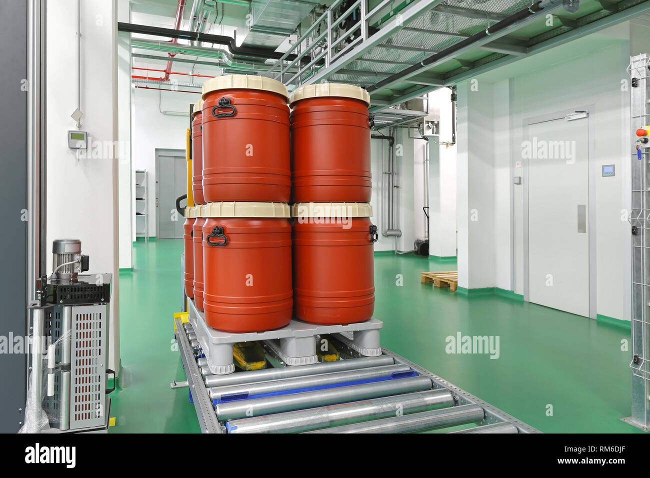 Plastic barrels at automated storage and retrieval system in warehouse ...