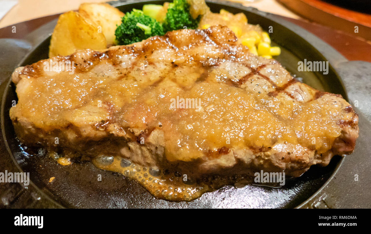 Steak cooked in Japanese style with orange sauce Stock Photo - Alamy